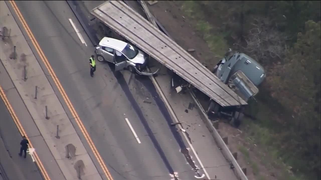 Person killed after semi-truck rolls over on Hwy 285, dumps load onto 5 ...