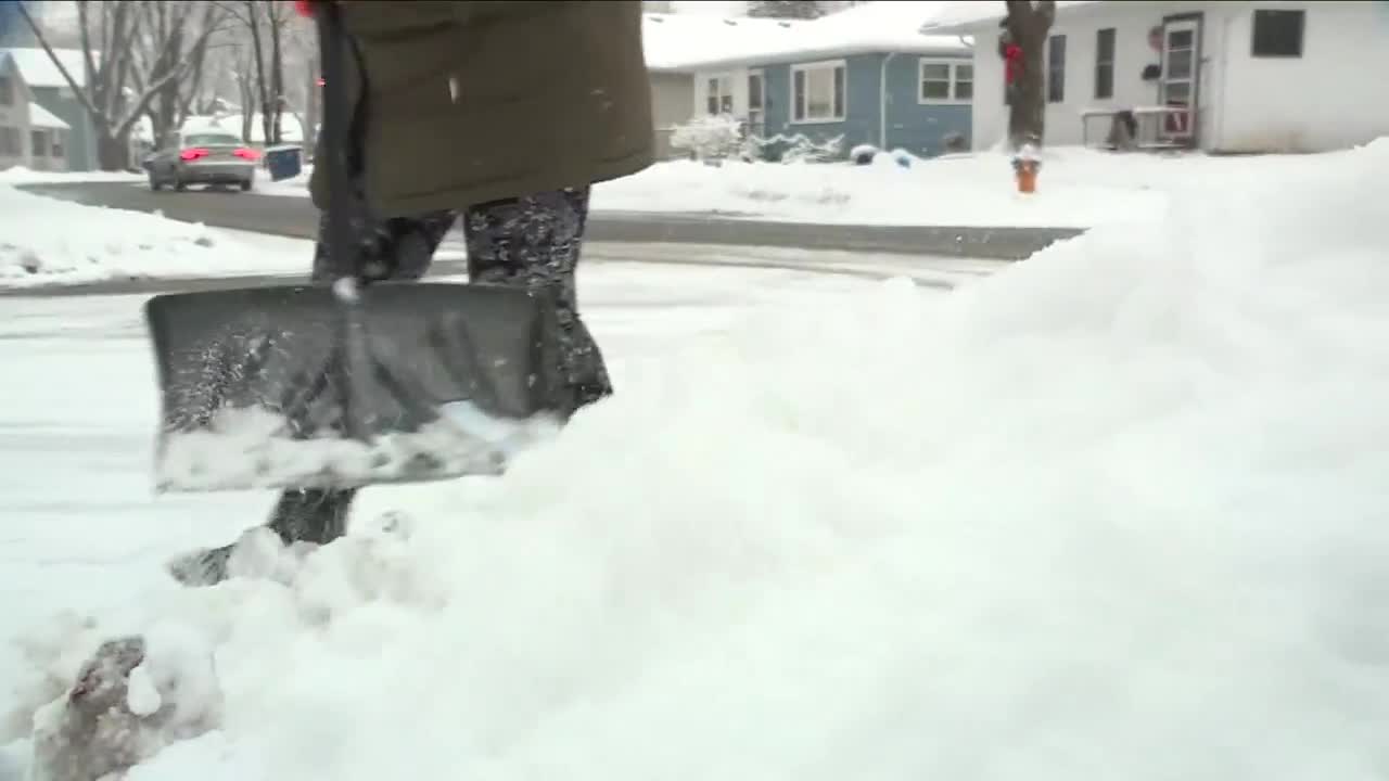 Family works together to help neighbors shovel snow