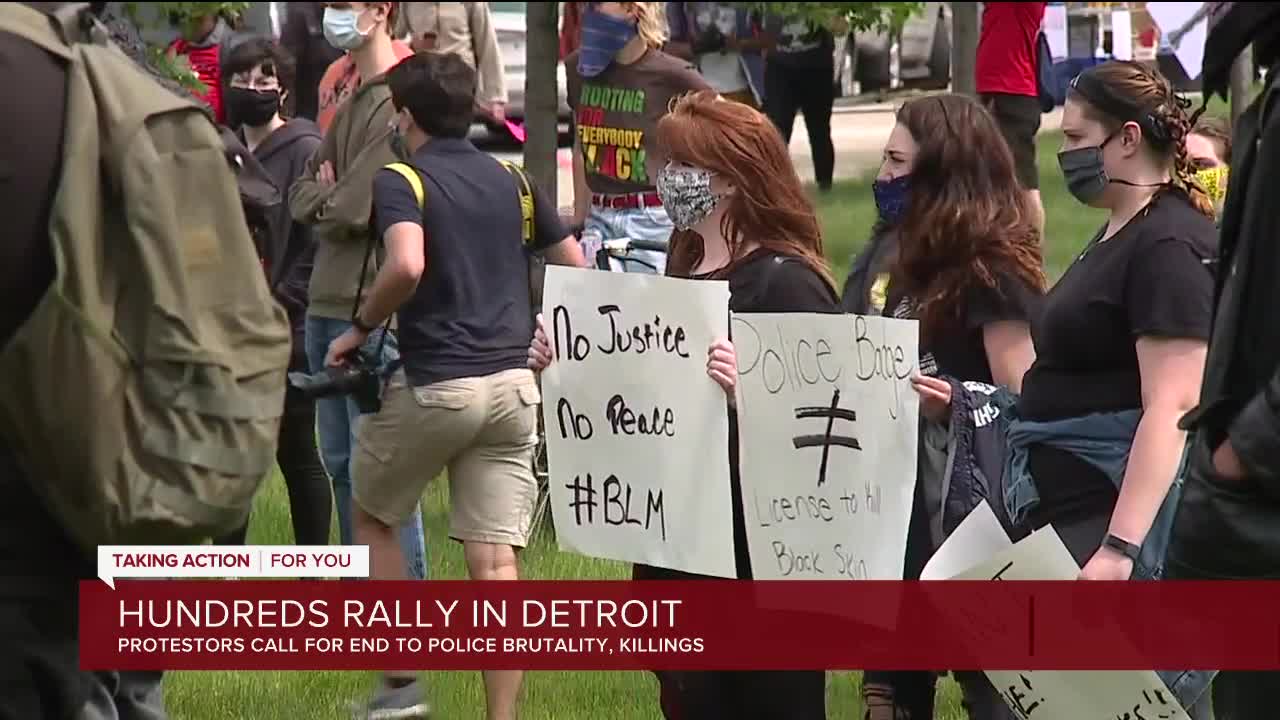 9 in custody as hundreds gather at rally in downtown Detroit