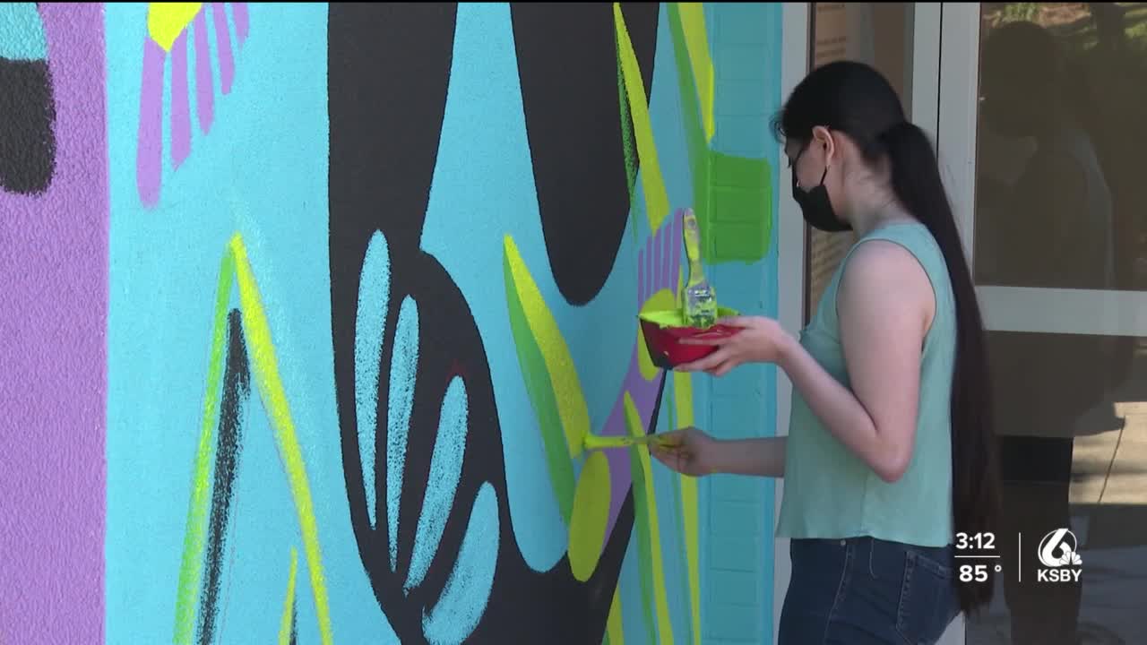 Second in a series of murals outside the SLO Art Museum being painted