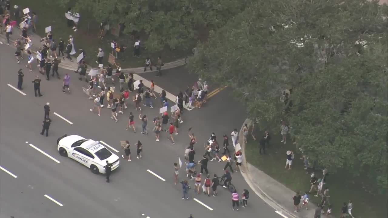 Protesters march along Indiantown Road in Jupiter