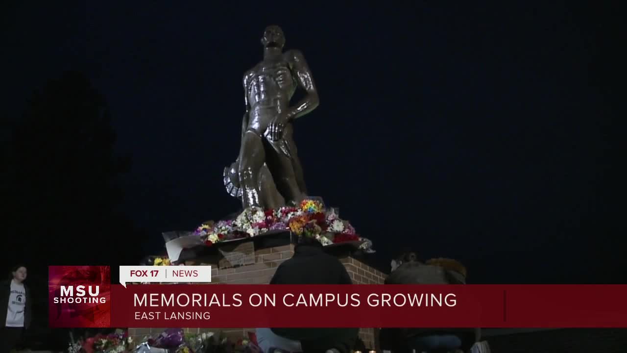 Makeshift memorial continues to grow at MSU 'Sparty' Statue