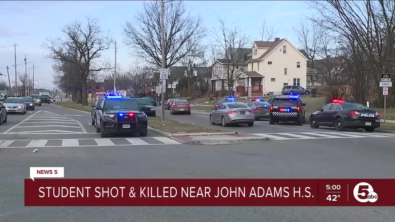 Student shot and killed at bus stop near John Adams high school