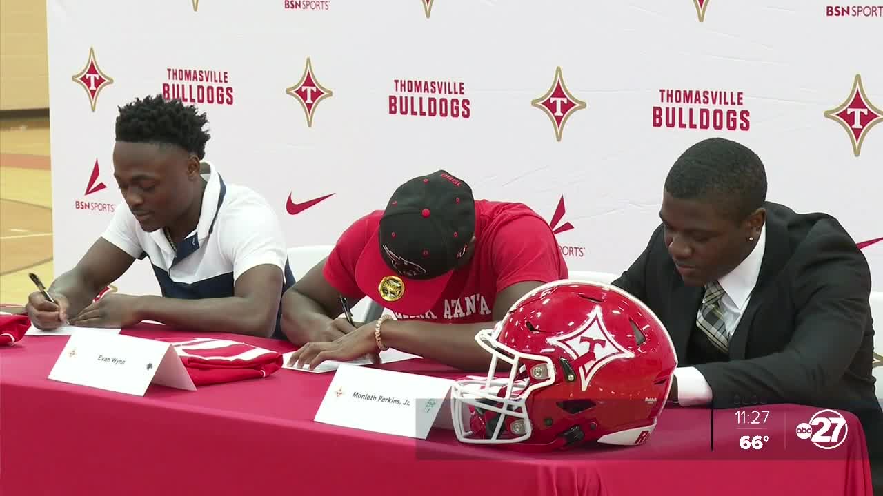 Football athletes sign with college programs during 2023 National ...