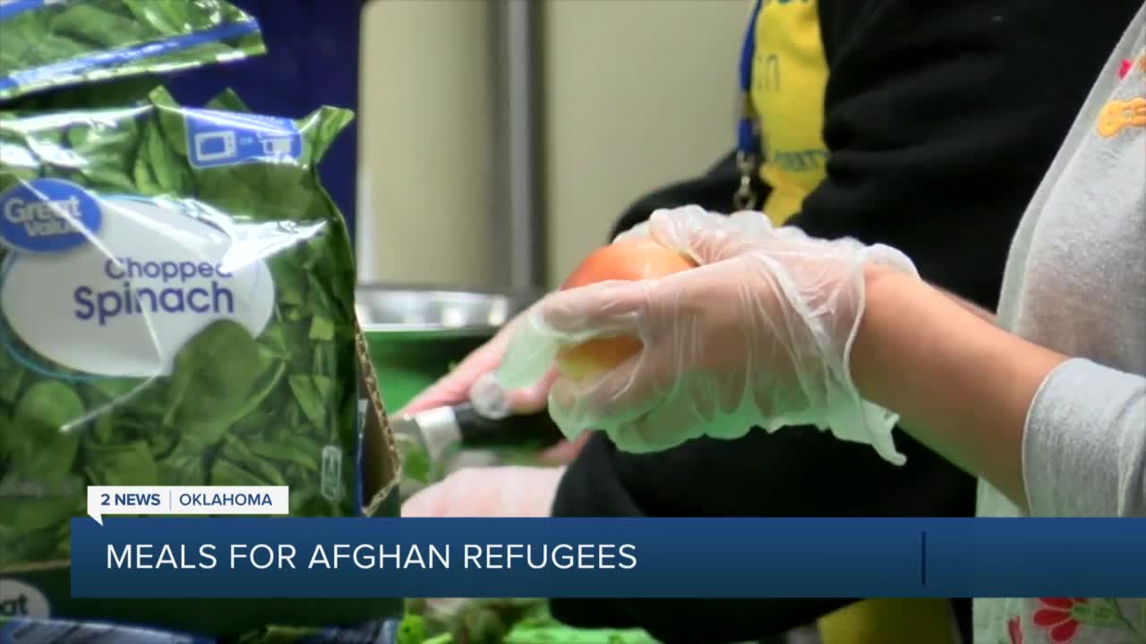 Volunteers cook hot meals for Afghan refugees