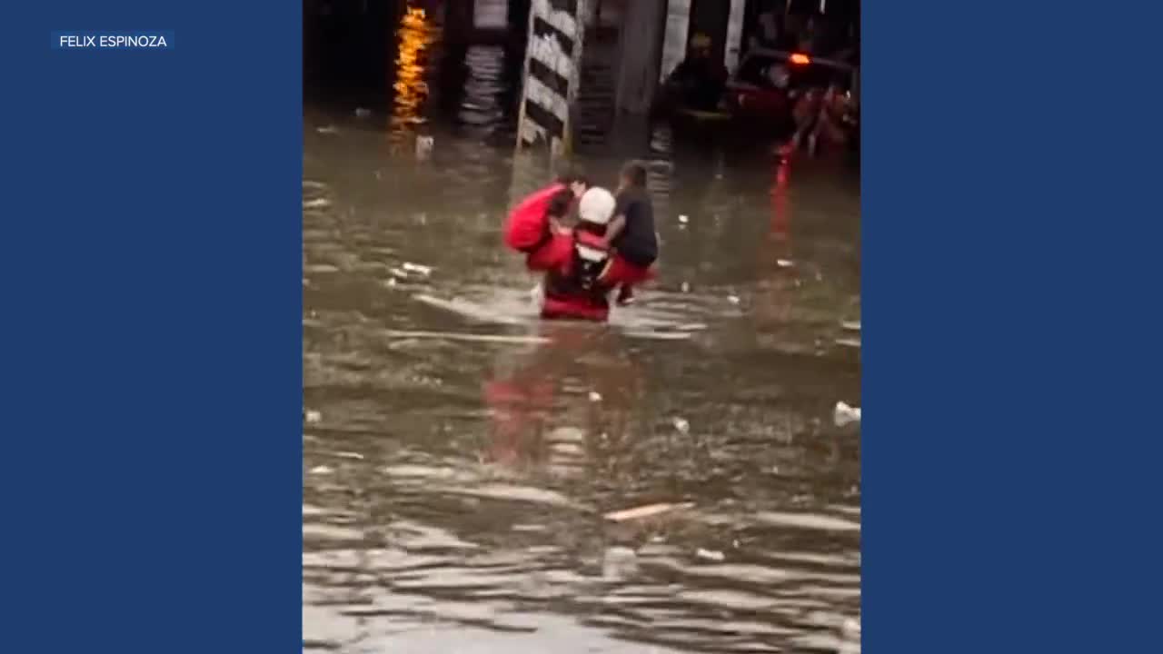 Eyewitness video shows Denver firefighter rescuing 2 children from flooding