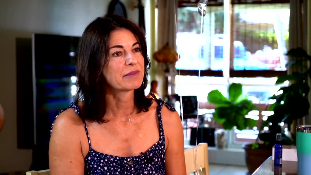 Looking through yearbook brings back memories for murder victim's classmate